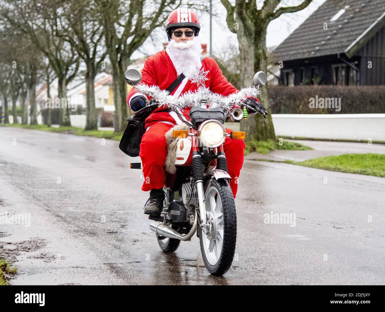 Santa Claus biking in the form of veteran mopeds at the Lucia's Day in ...