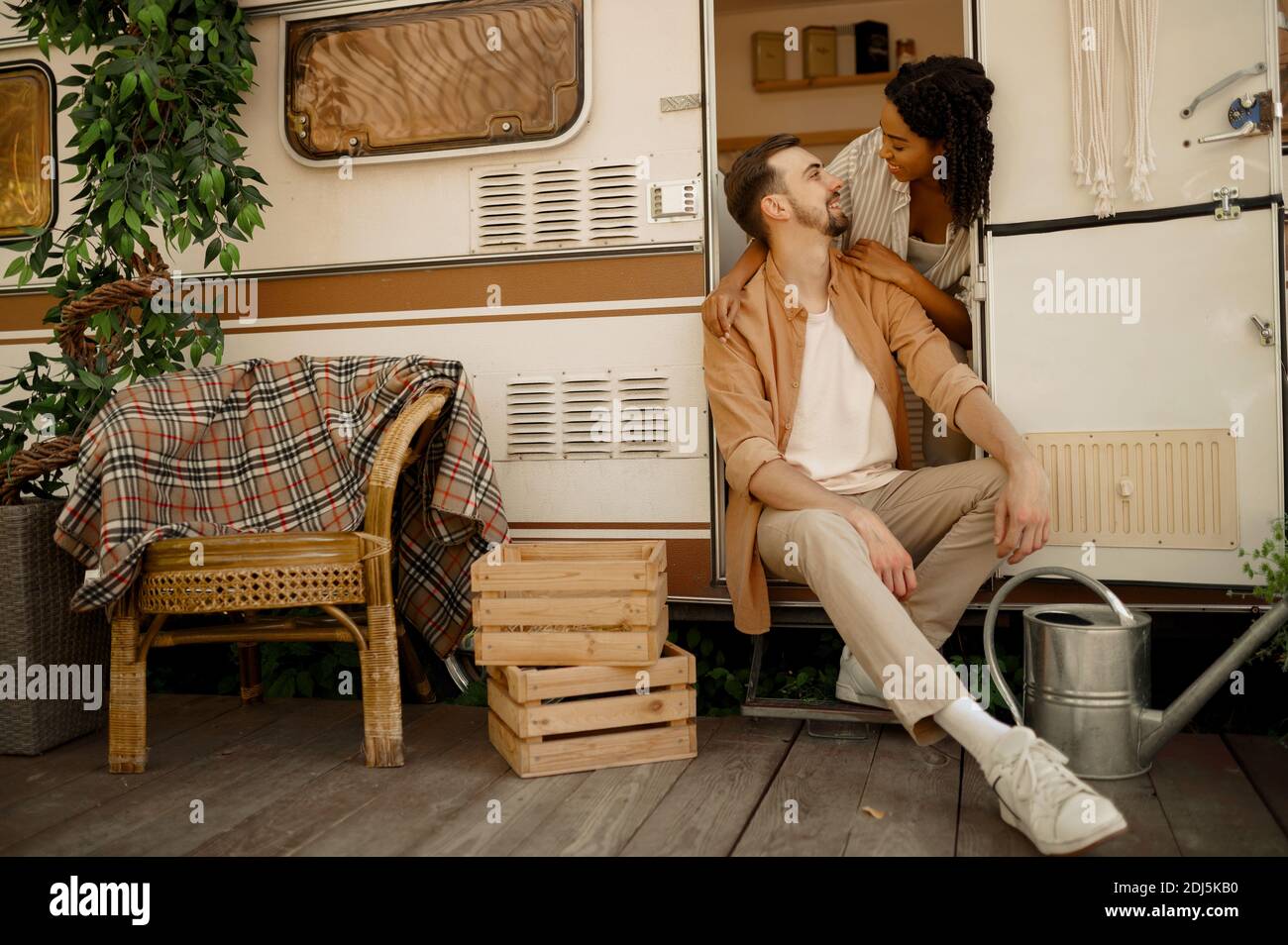 Love couple hugs in rv, camping in a trailer Stock Photo - Alamy