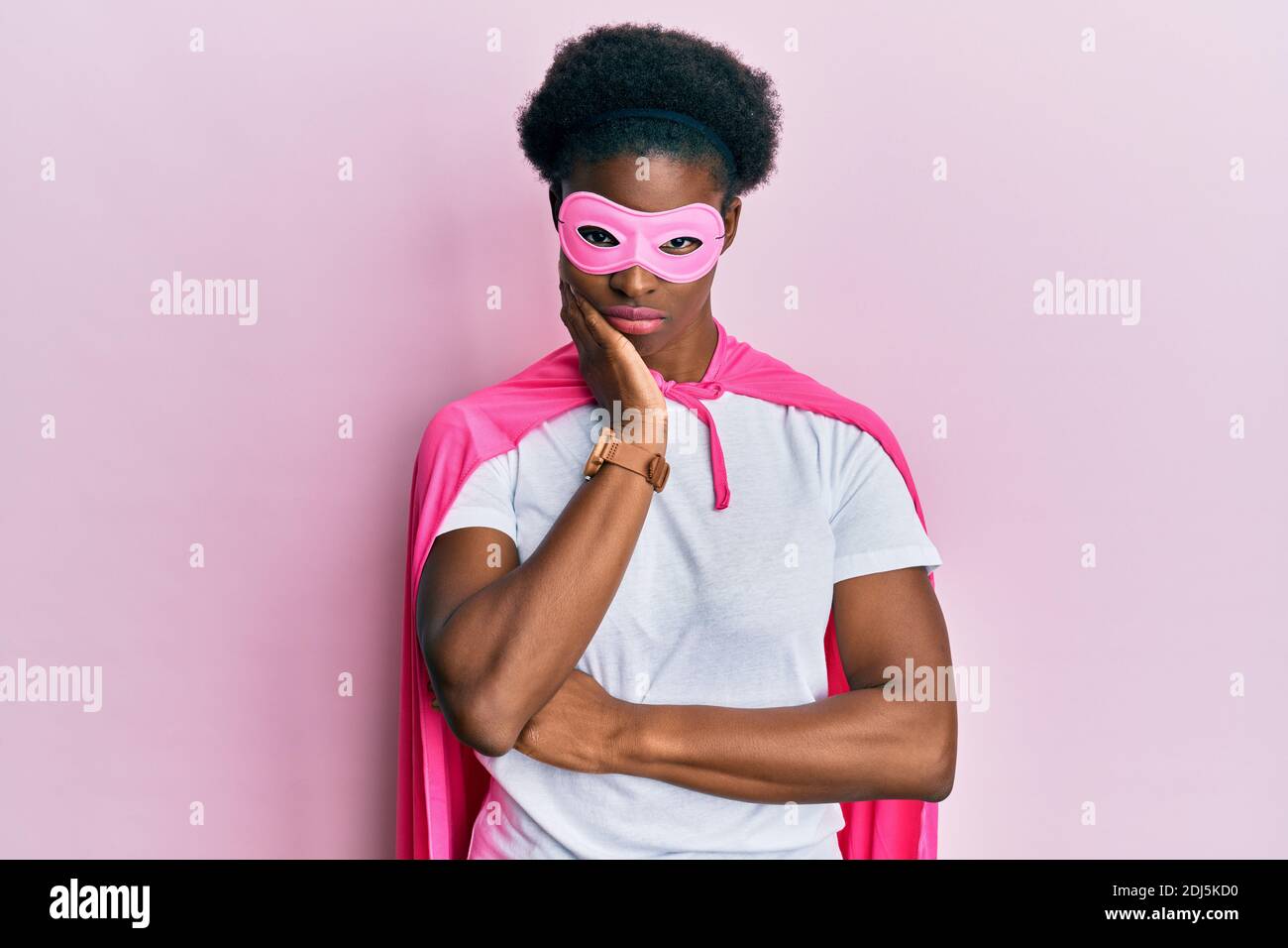 Young african american girl wearing superhero mask and cape costume ...