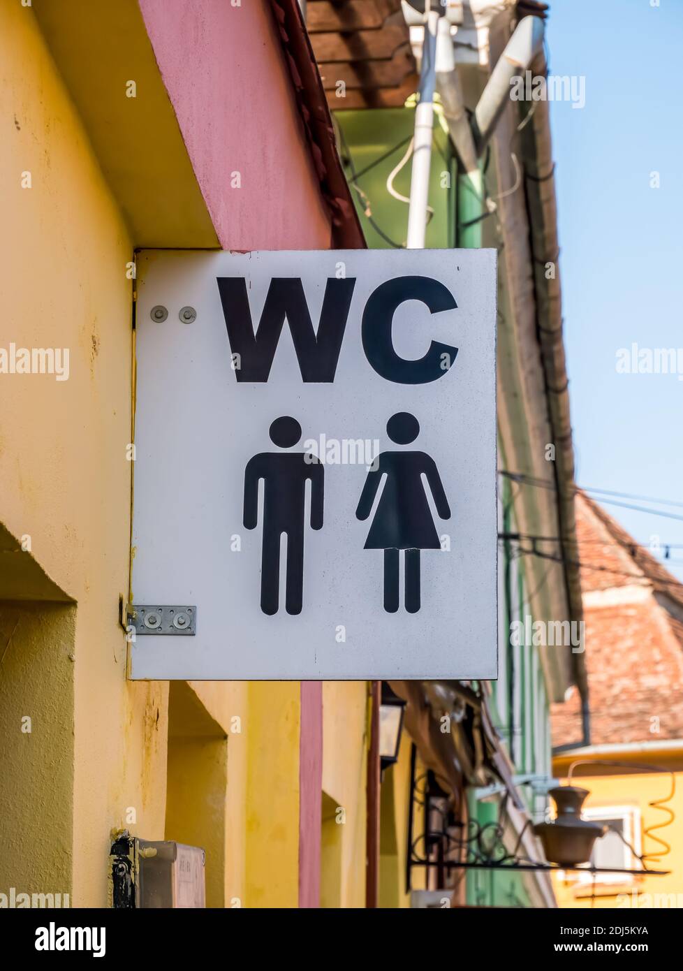 Outdoor WC restroom sign in Sighisoara Romania Stock Photo - Alamy