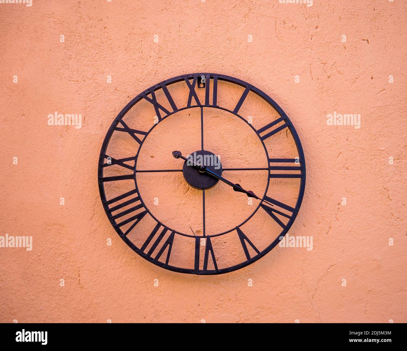 Old medieval metal clock on a wall in Sighisoara, Romania Stock Photo ...