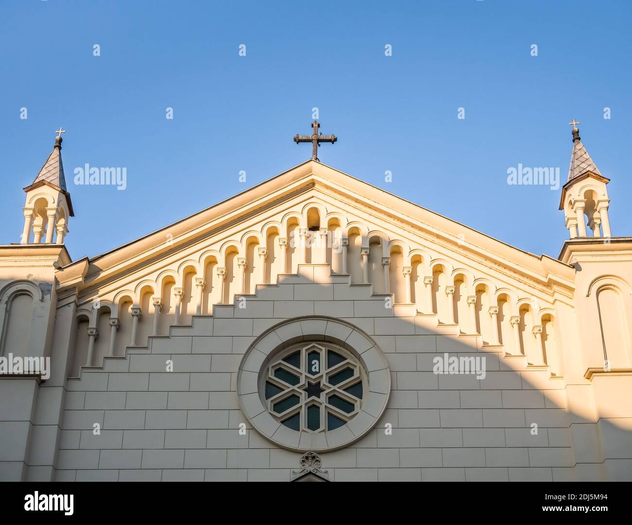 Architectural detail of a Roman Catholic christian church facade with a ...