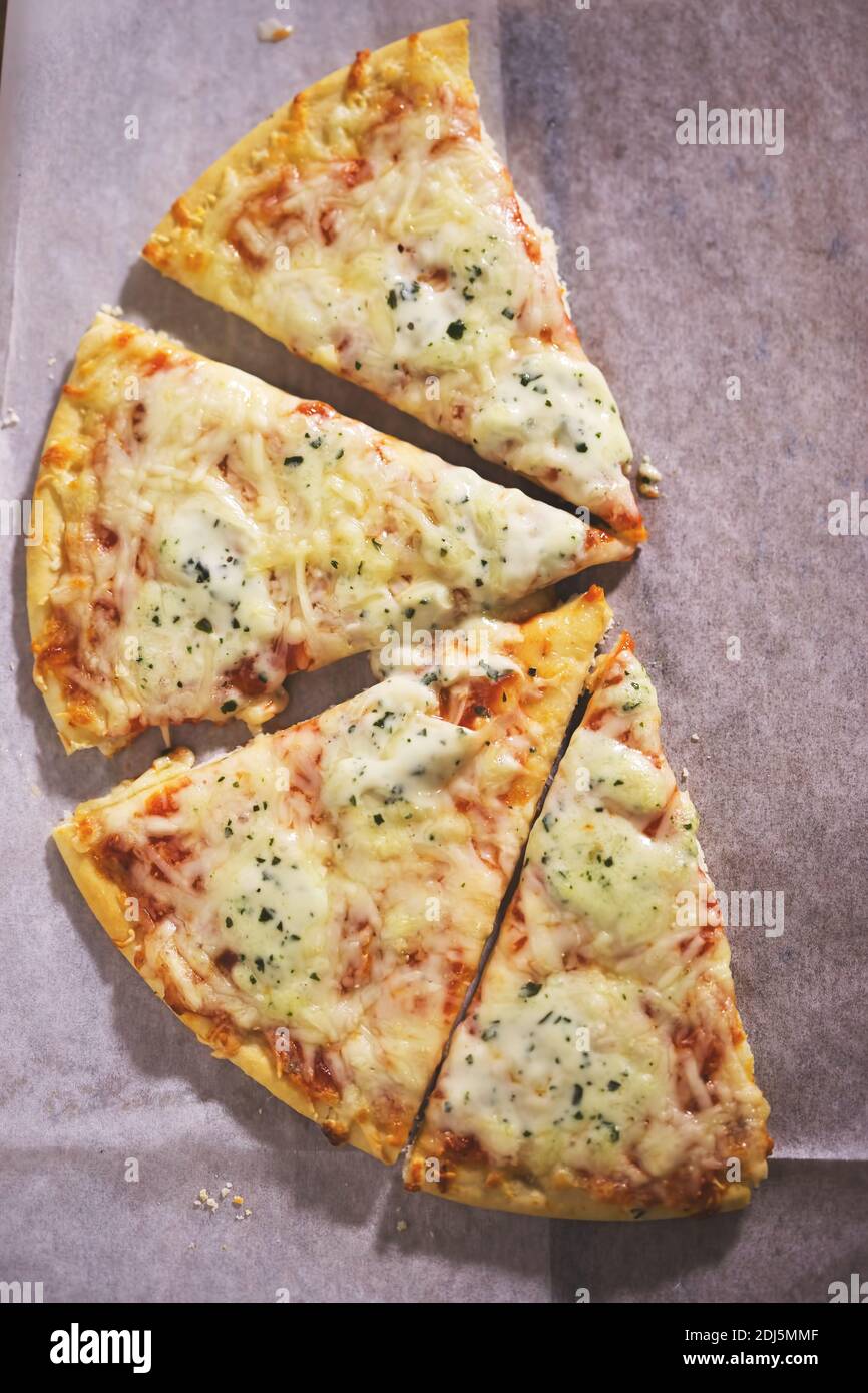 Four cheese pizza with tomato sauce Stock Photo - Alamy