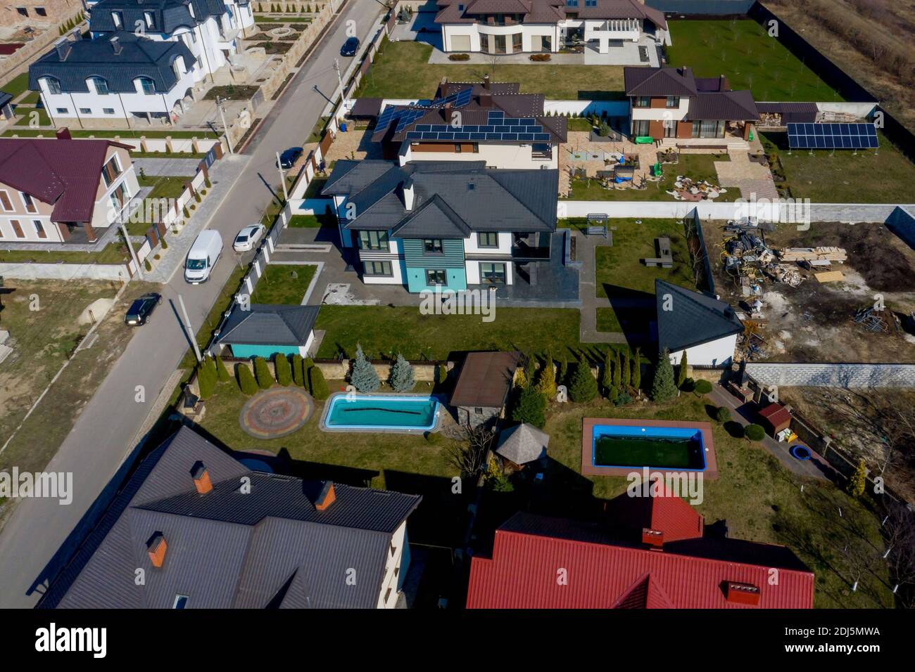 aerial view of houses on Ukraine housing estates, some with building on ...