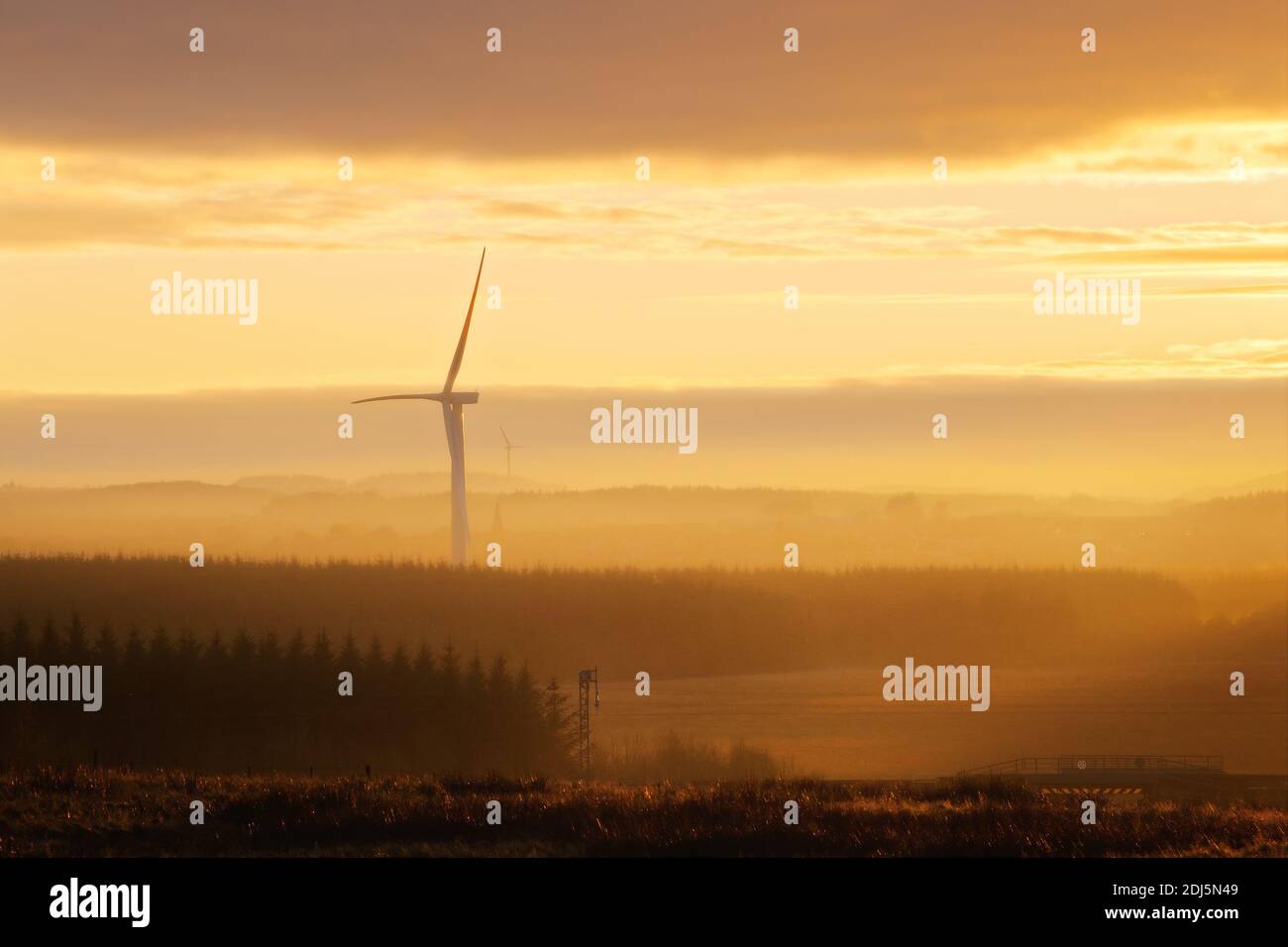 Wind power turbines in the countryside at sunset. West Lothian ...