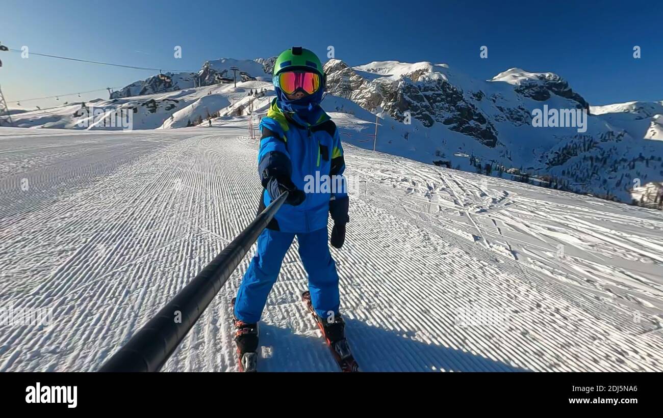 Little boy skiing. A 6 year old child enjoys a winter holiday in the ...