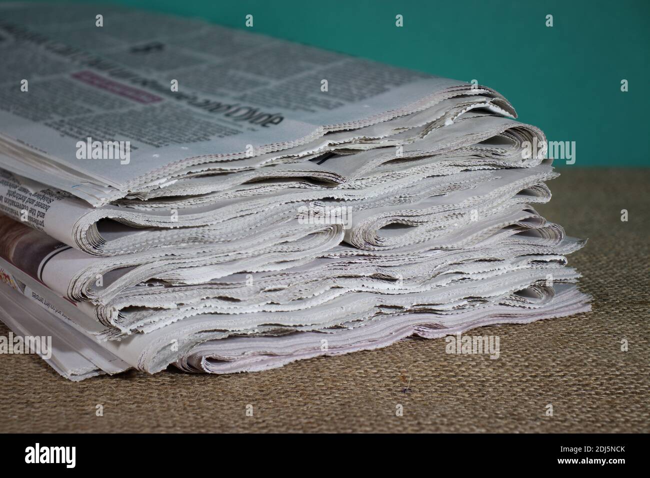 Folded newspapers in a stack Stock Photo - Alamy