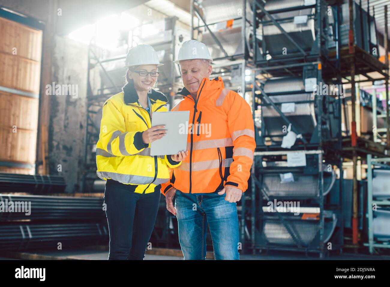 Workers checking inventory of warehouse Stock Photo - Alamy