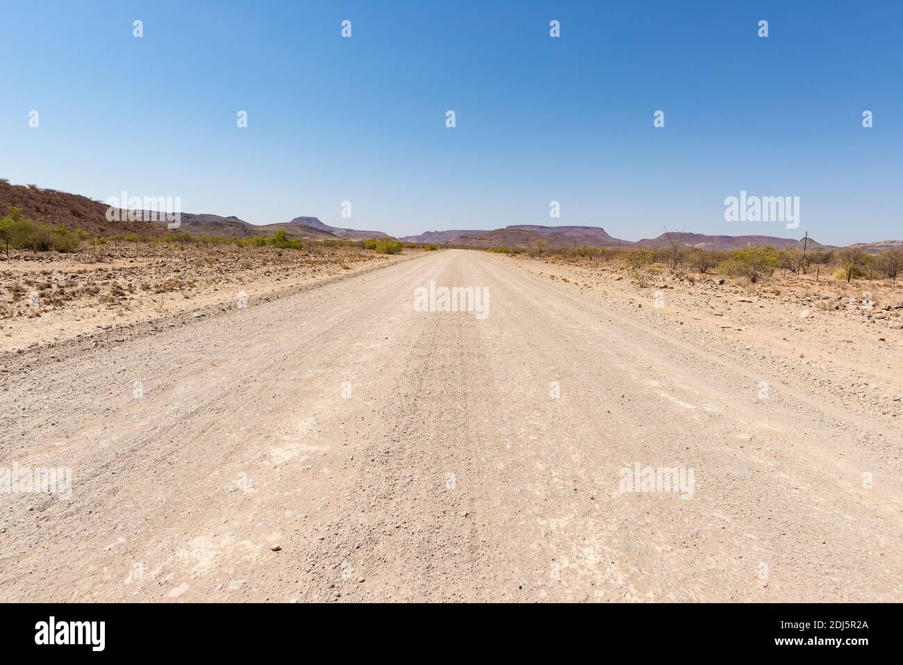 Gravel road crossing the Namib desert, in the majestic Namib Naukluft ...
