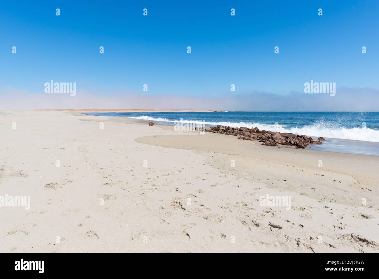 Sandy beach and coast line on the Atlantic ocean at Cape Cross, Namibia ...