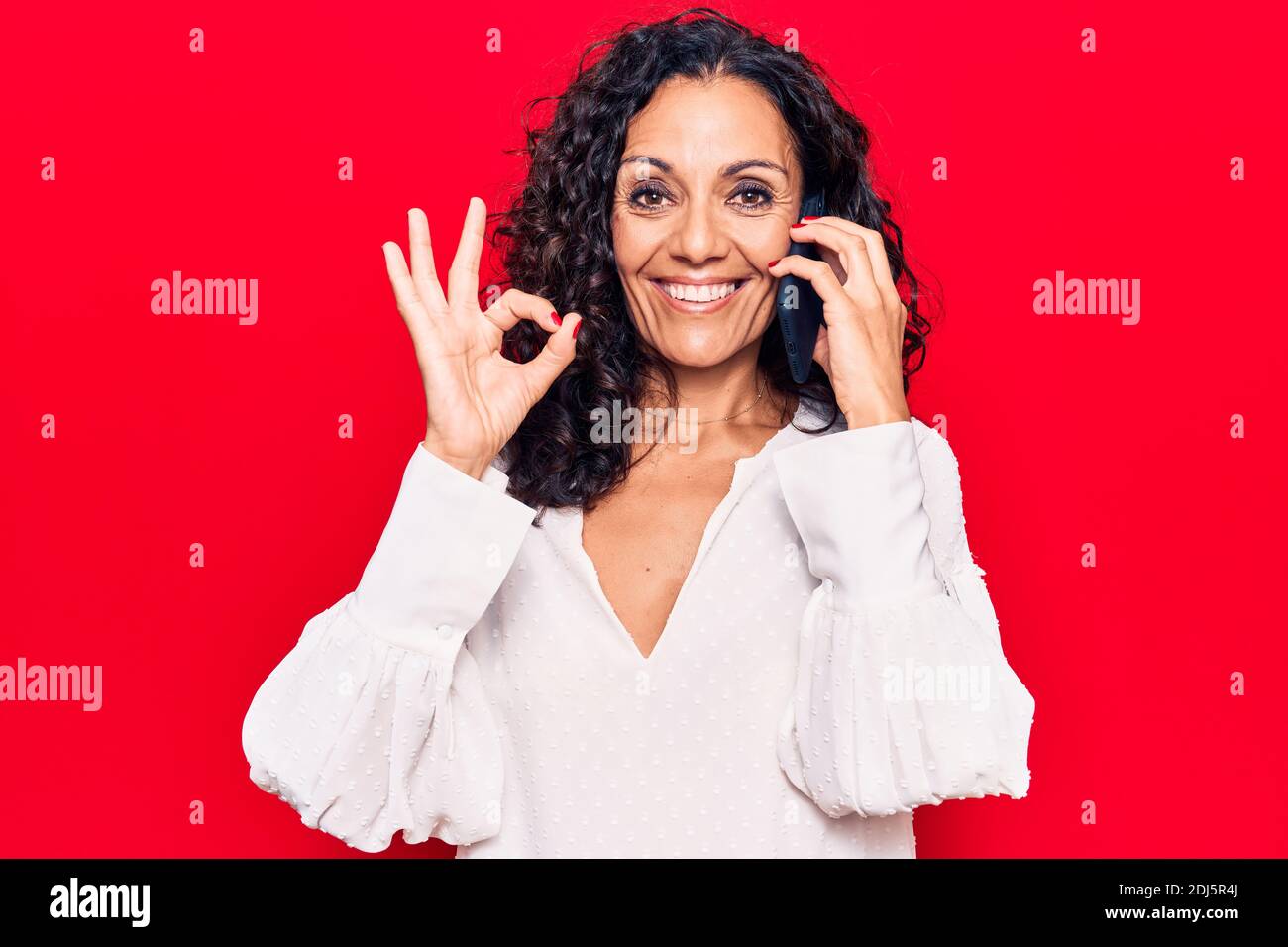 Middle age beautiful woman having conversation talking on the ...
