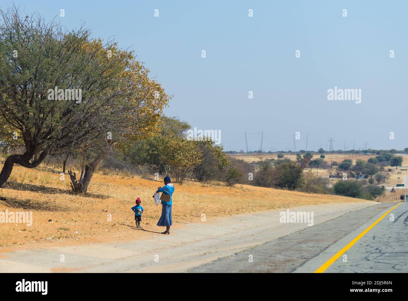 Poor people walking on the roadside in the rural Caprivi Strip, the ...