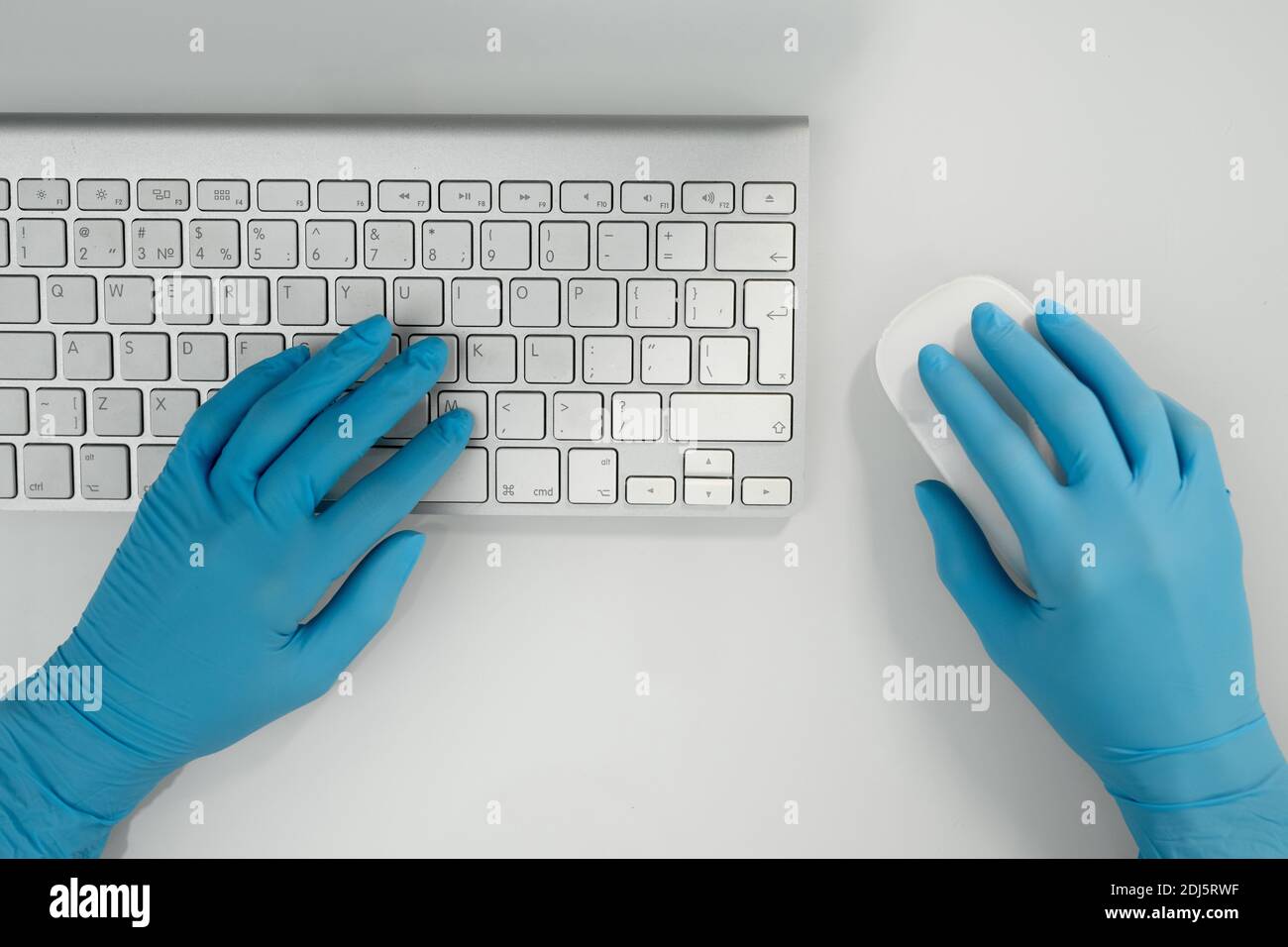 Gloved hand holding mouse hi-res stock photography and images - Alamy