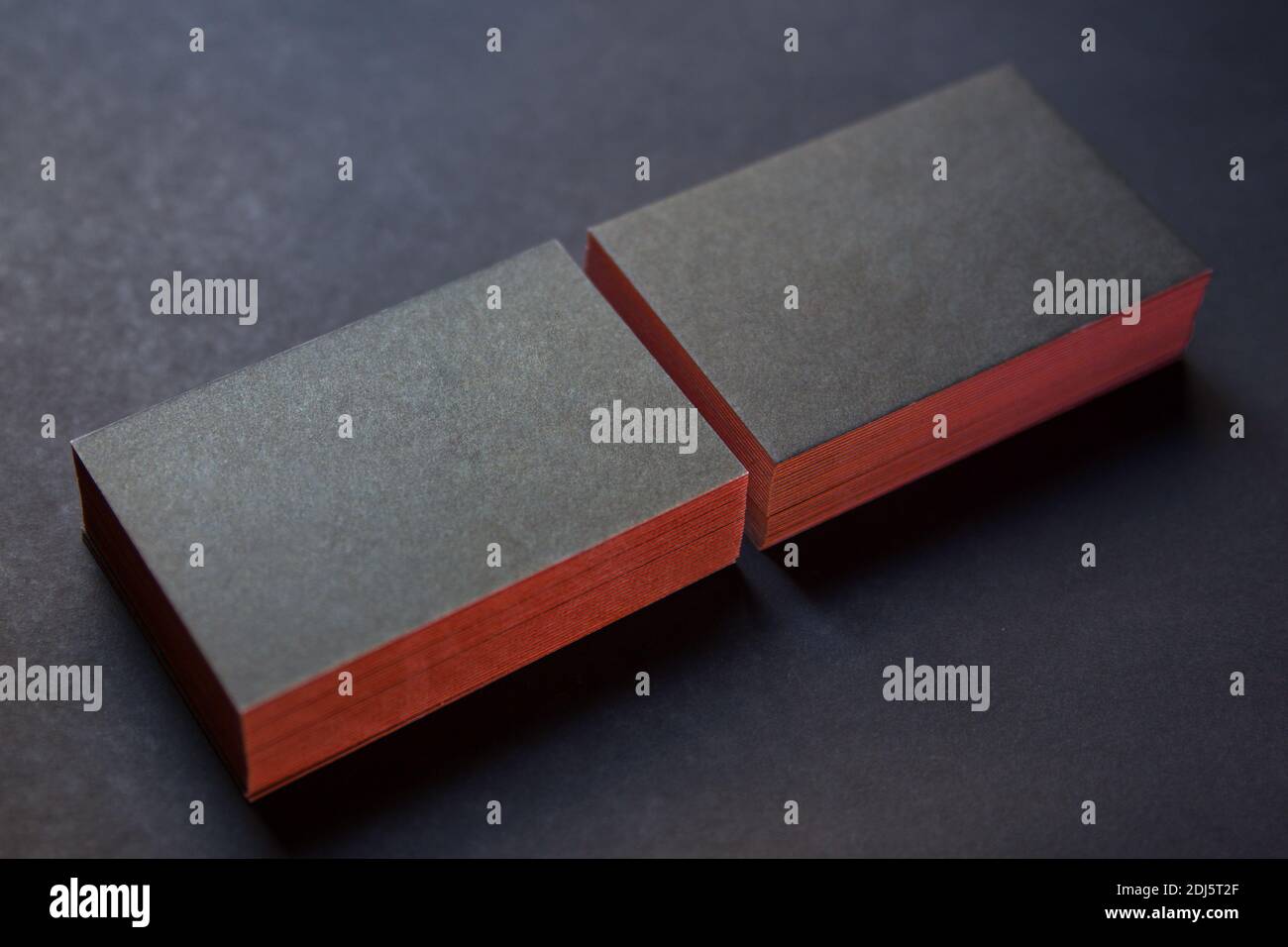 Black business card mockup to insert your design. Two piles of cards on ...