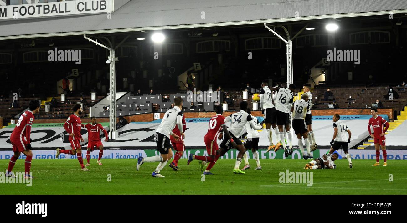 Fulham's Aboubakar Kamara hand balls the free kick to give away a ...