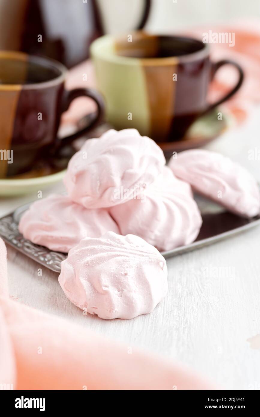 Russian Strawberries with cream marshmallows and tea on a bright table ...