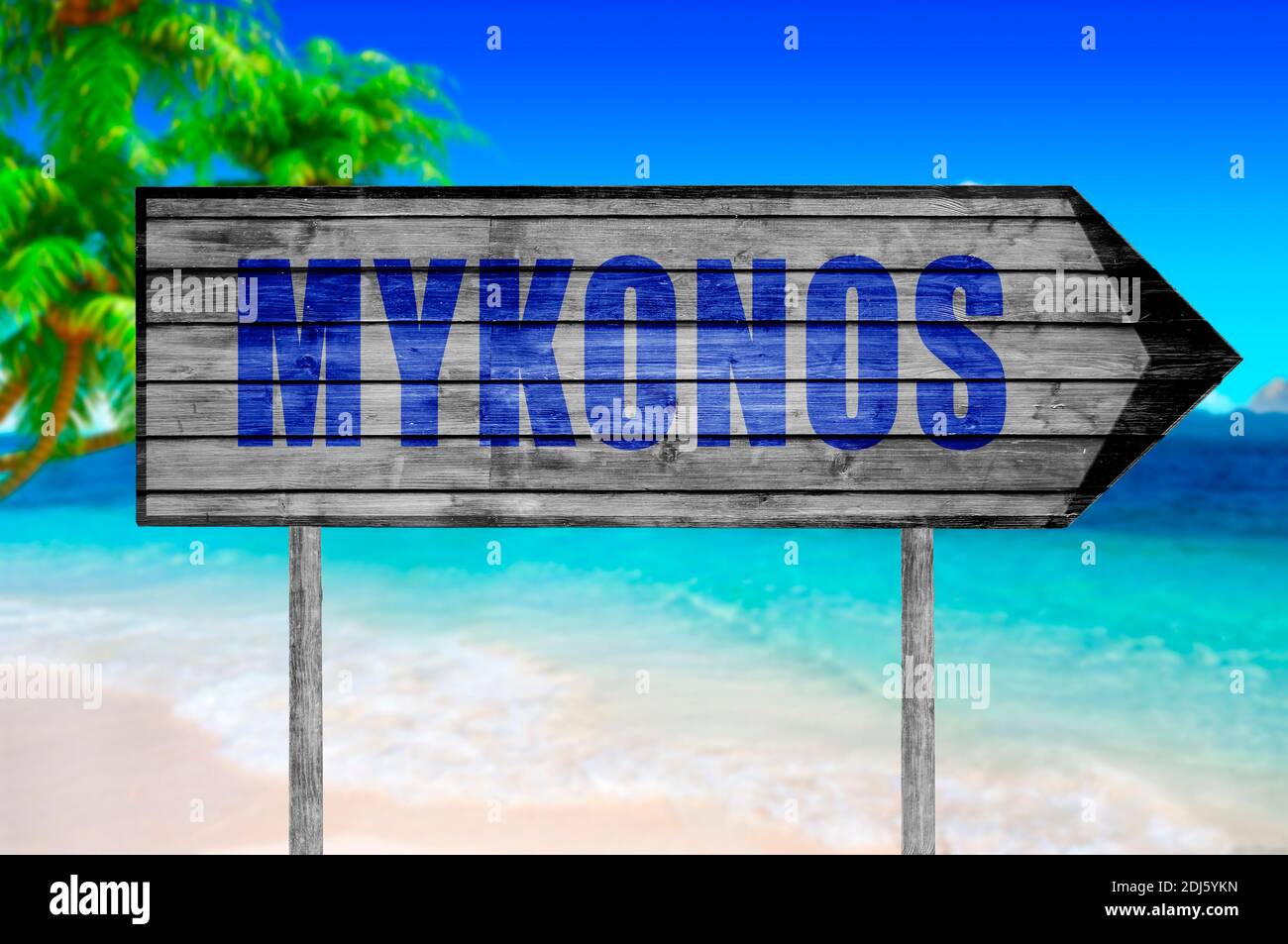 Mykonos wooden sign with beach background Stock Photo - Alamy