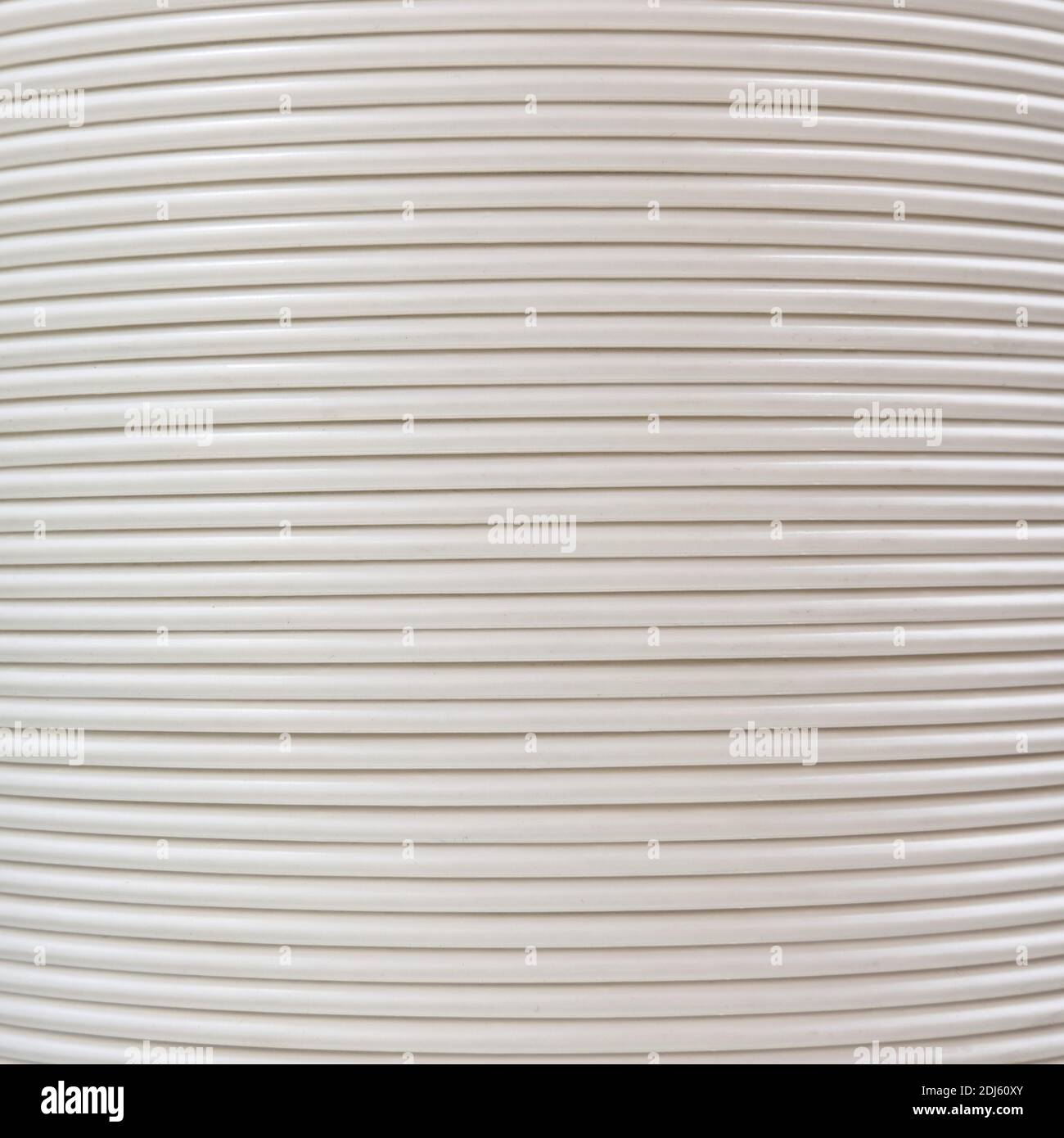 Background of white corrugated pipe. Texture of corrugation rings close ...