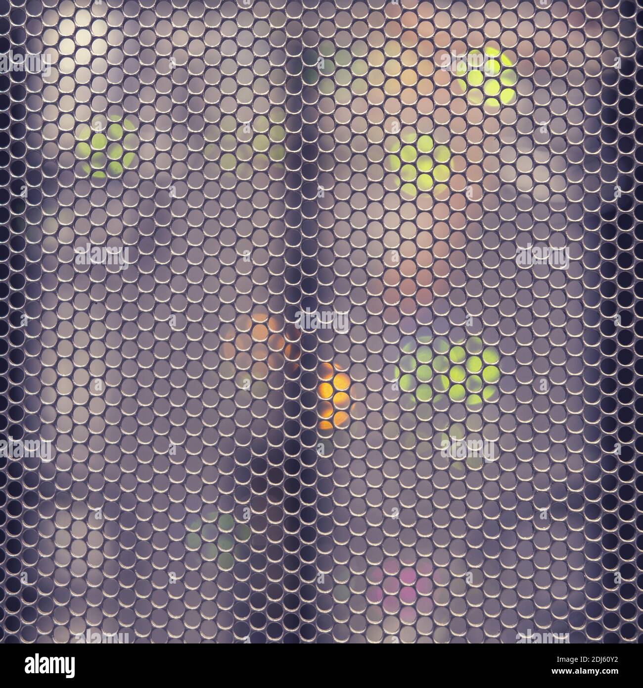 Background of a convex metal surface with round lattice holes and ...