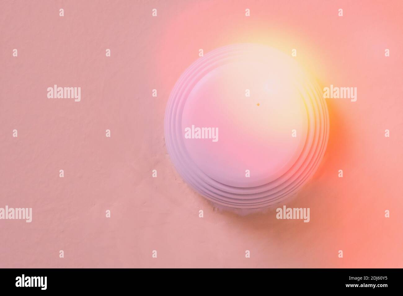 Smoke detector with white smoke and red warning light. Sensor on beige ...