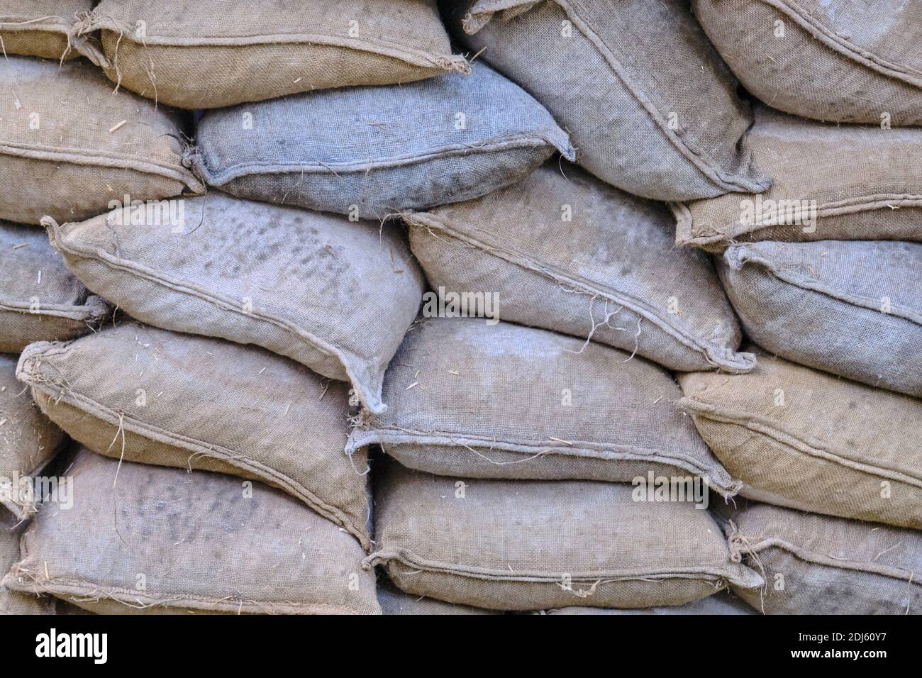 Texture lying on each other old sandbags. Piled sandbags for protection ...