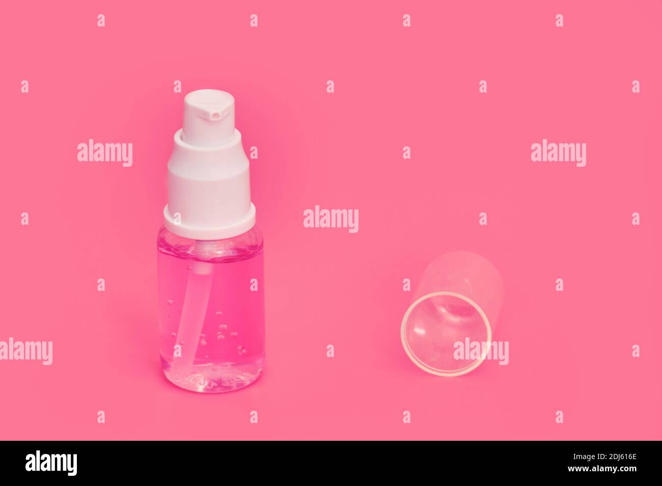 Medical hand hygiene product with pink liquid, spray sanitizer close-up ...