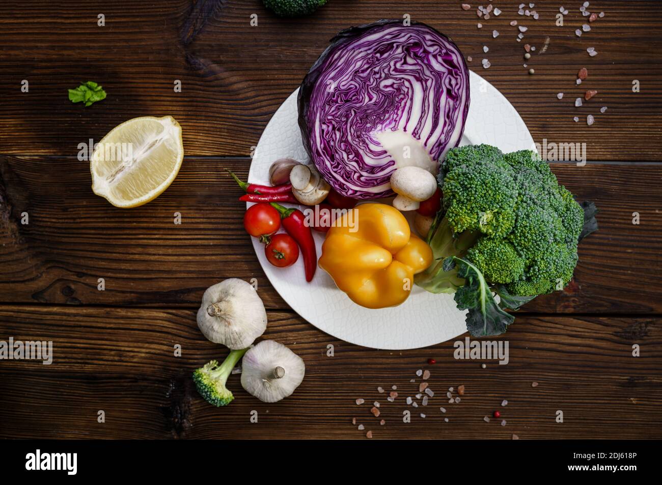 Vegetables in plates, top view, wooden background Stock Photo - Alamy