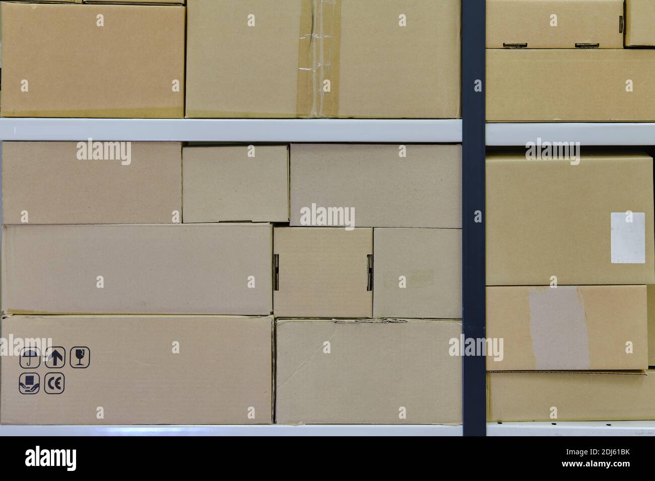 Boxes with goods are on storage racks. Background of cardboard boxes ...