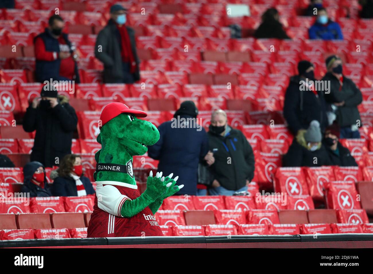 Arsenal mascot Gunnersaurus in the stands with the fans, before the ...