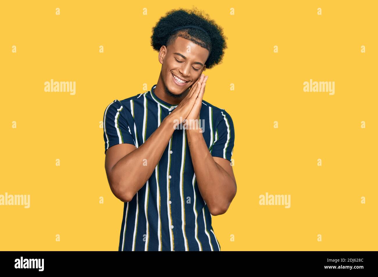 African american man with afro hair wearing casual clothes sleeping ...