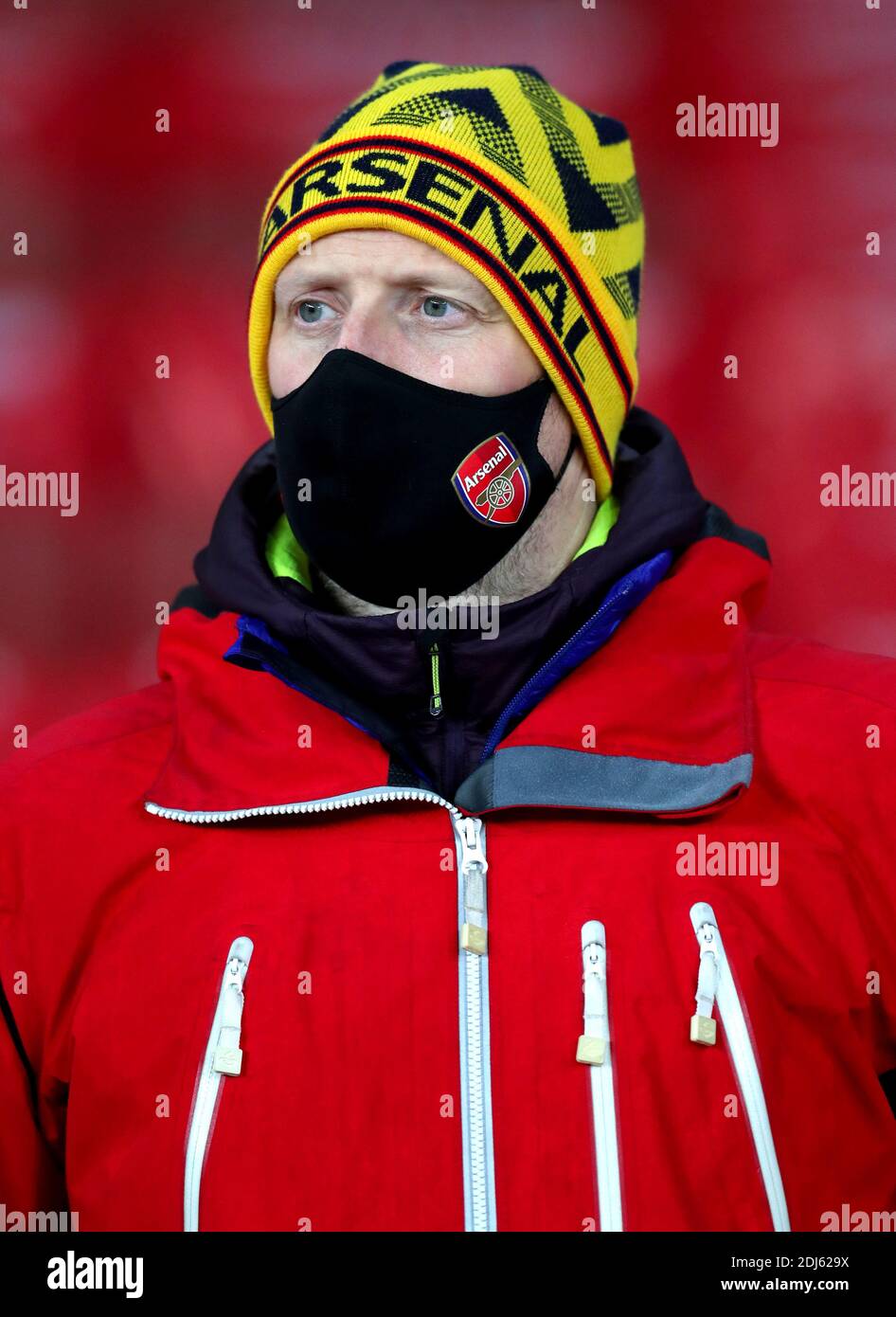 An Arsenal fan wearing a face mask in the stands during the Premier ...
