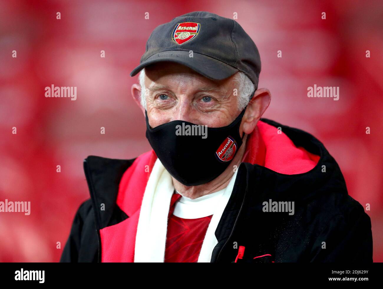 An Arsenal fan wearing a face mask in the stands during the Premier ...