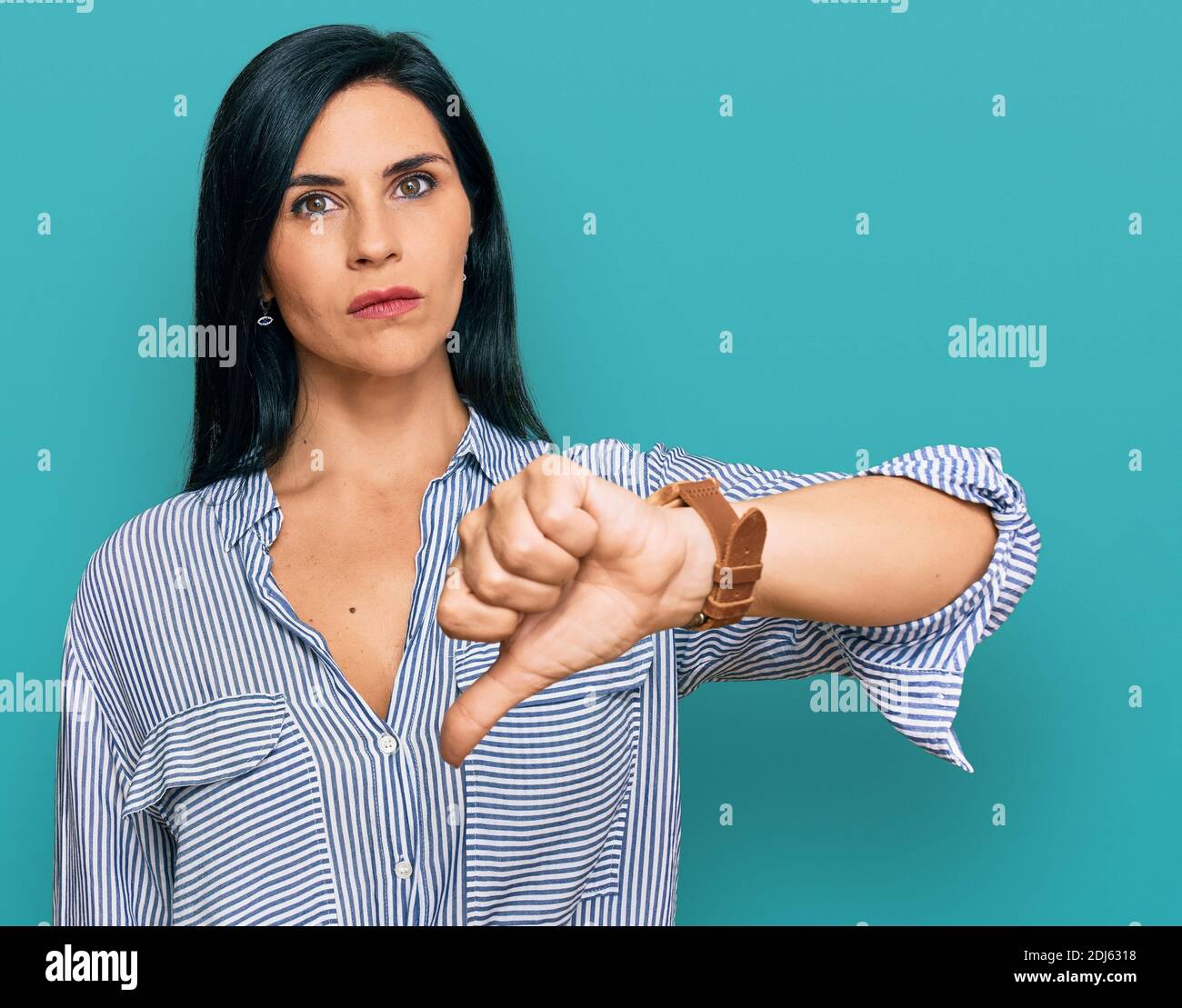 Young caucasian woman wearing casual clothes looking unhappy and angry ...