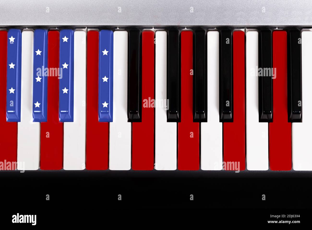 close-up of piano or synthesizer keys painted in the colors of the ...