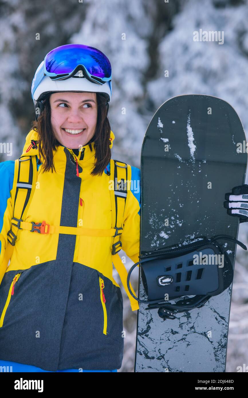 pretty woman snowboarder portrait winter activities Stock Photo - Alamy