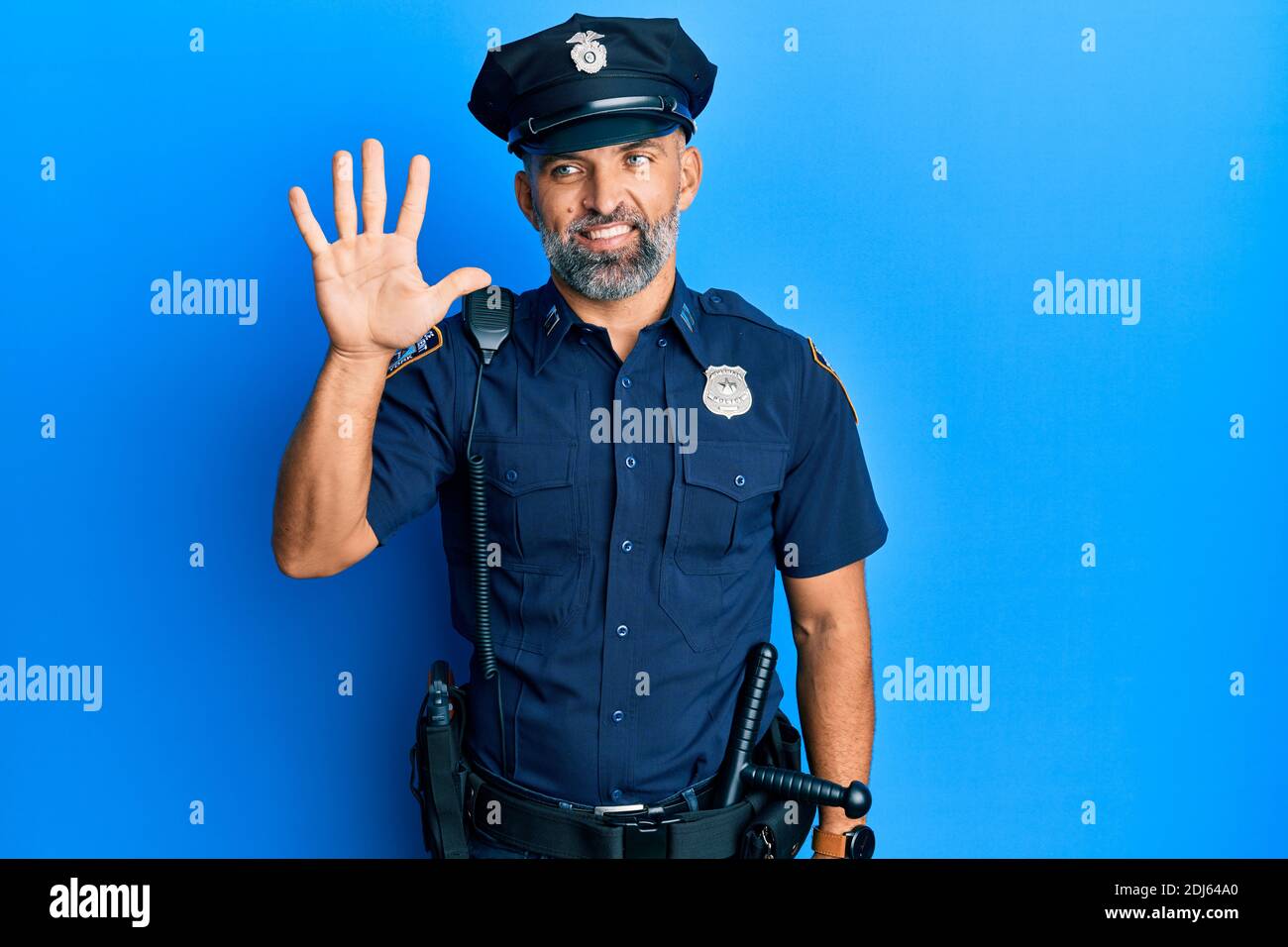 Middle age handsome man wearing police uniform showing and pointing up ...