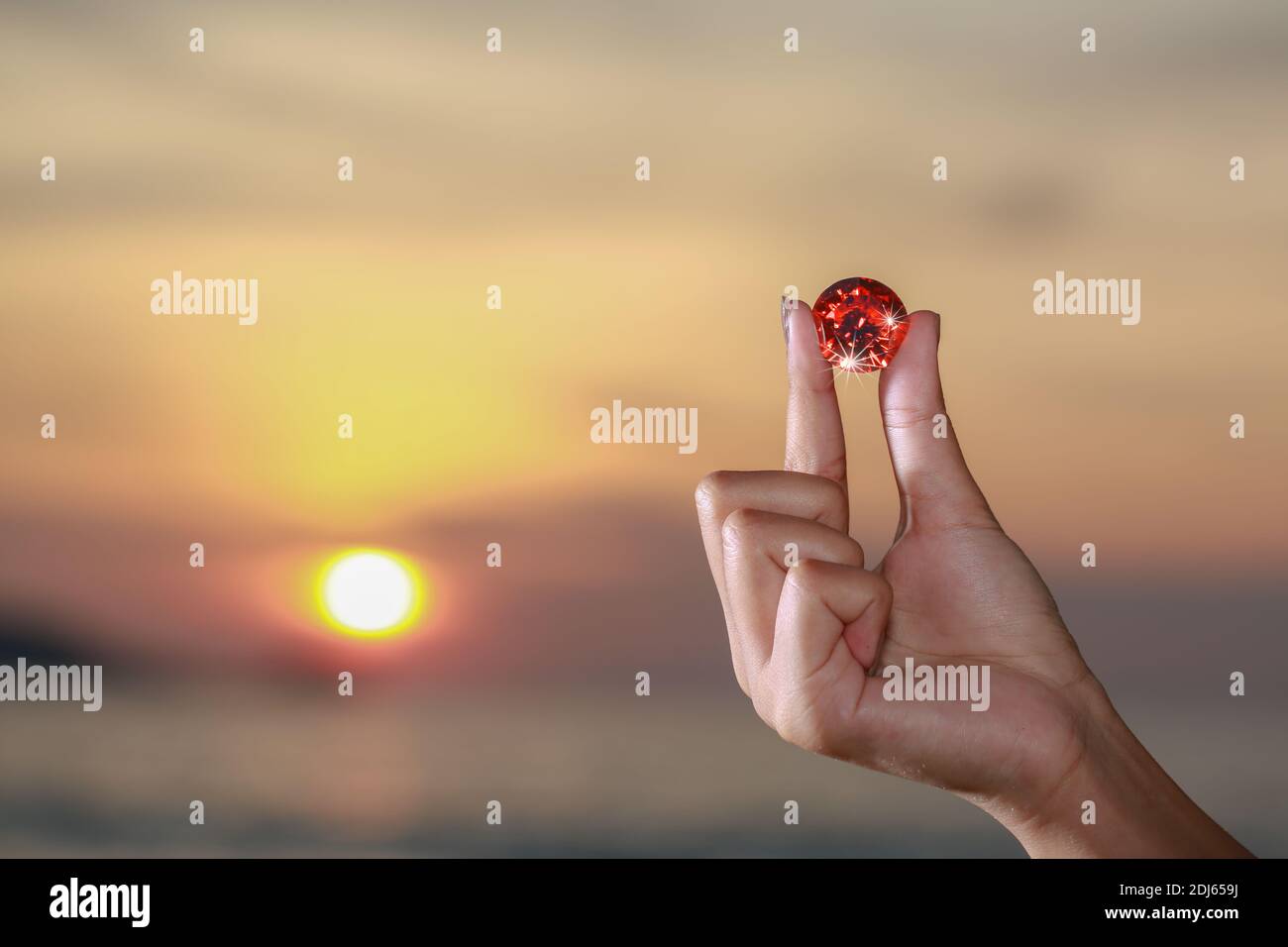 pick the red ruby diamond in to the sun at Patong beach,Phuket Stock ...