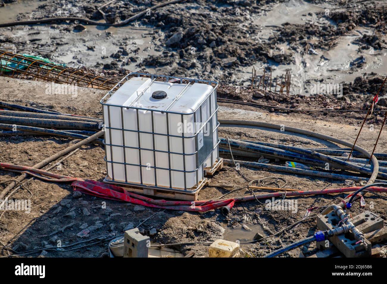 Plastic water tank at the construction site. Polyethylene container on ...