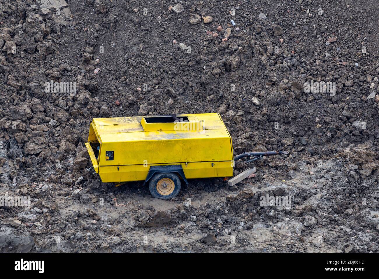 Yellow diesel mobile generator at a construction site Stock Photo - Alamy