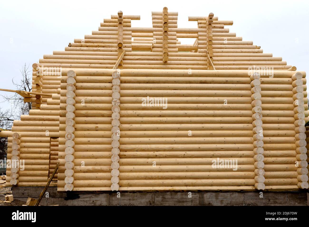 Construction of a Christian church made of wooden treated logs by hand ...