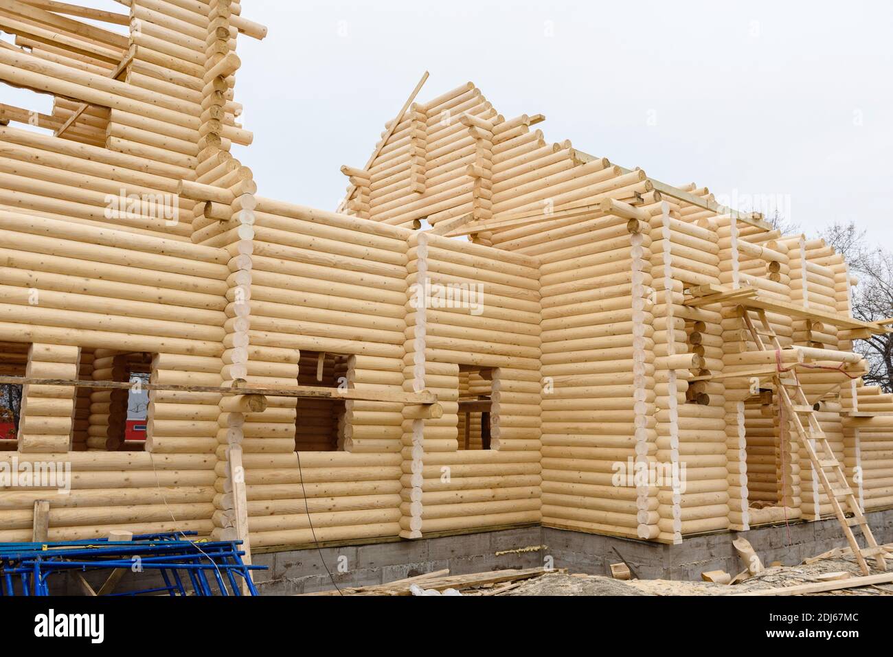 Construction of a Christian church made of wooden treated logs by hand ...
