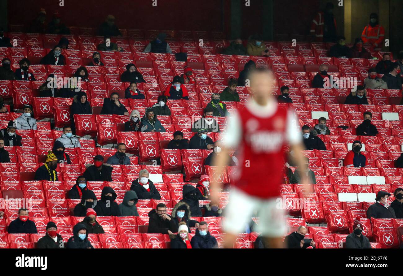 Arsenal fans watch from the stands during the Premier League match at ...