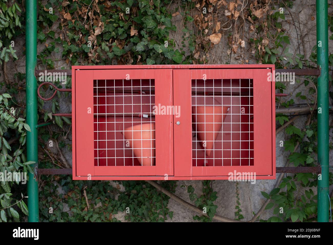 a fire shield with the necessary filling, hanging on the wall with ...