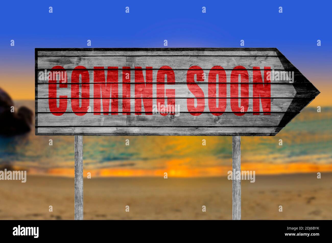 Red Coming Soon wooden sign with on a beach background Stock Photo - Alamy
