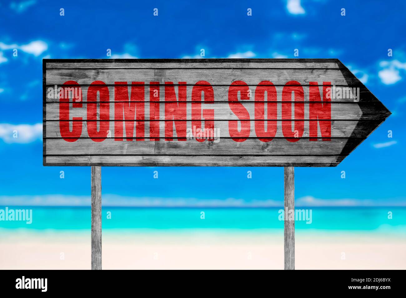 Red Coming Soon wooden sign with on a beach background Stock Photo - Alamy