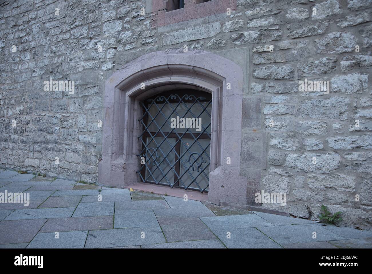 Barred basement window of medieval old town hall. Göttingen German ...