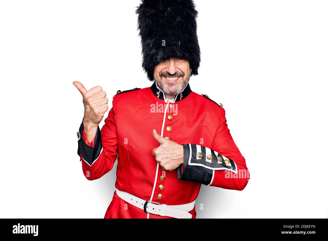 Middle age handsome wales guard man wearing traditional uniform over ...