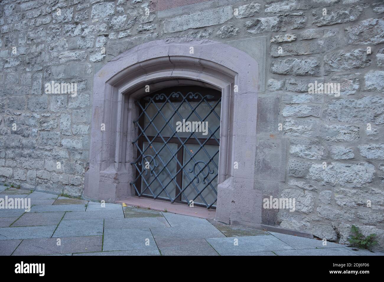 Barred basement window of medieval old town hall. Göttingen German ...