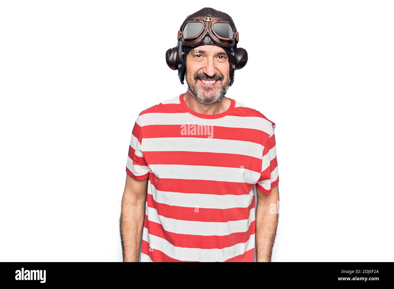 Middle age aviator man wearing vintage helmet and glasses over isolated ...