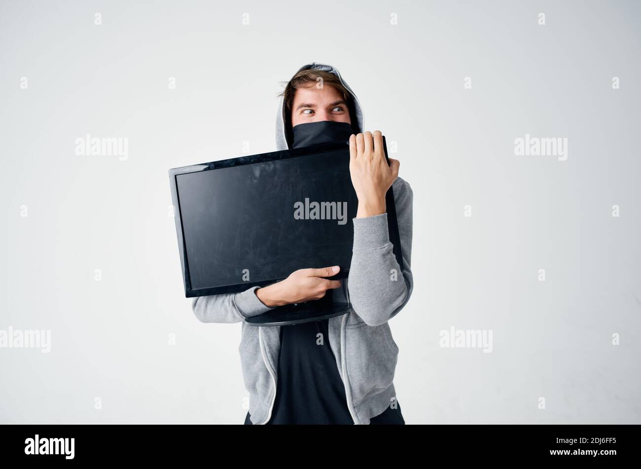 man steals monitor running away pursuit theft Stock Photo - Alamy